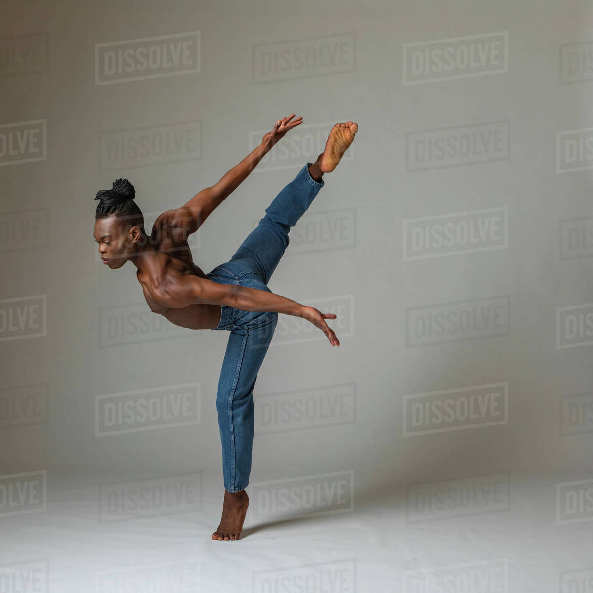 Studio shot of man dancing - Royalty-free Stock Photo | Dissolve