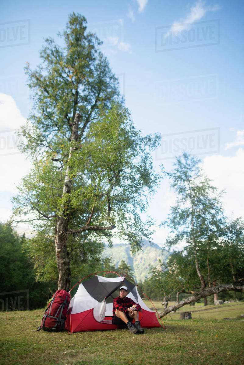 Russia , Karachay-Cherkessia, Arkhyz, Caucasus mountains, Hiker sitting ...