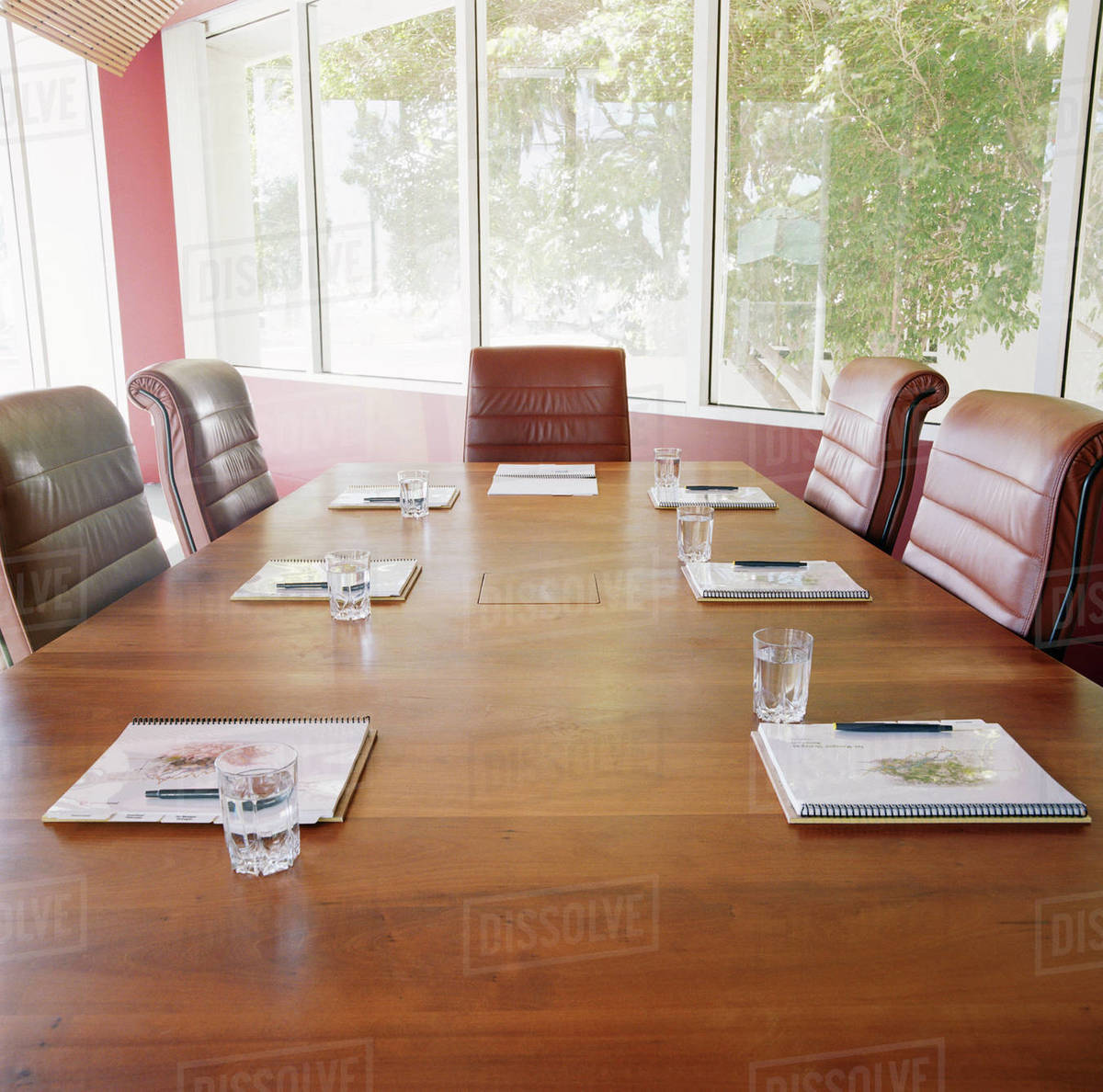Empty conference room with paperwork - Royalty-free Stock Photo | Dissolve