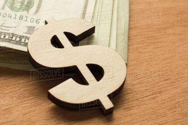 Dollar sign and cash - Royalty-free Stock Photo | Dissolve