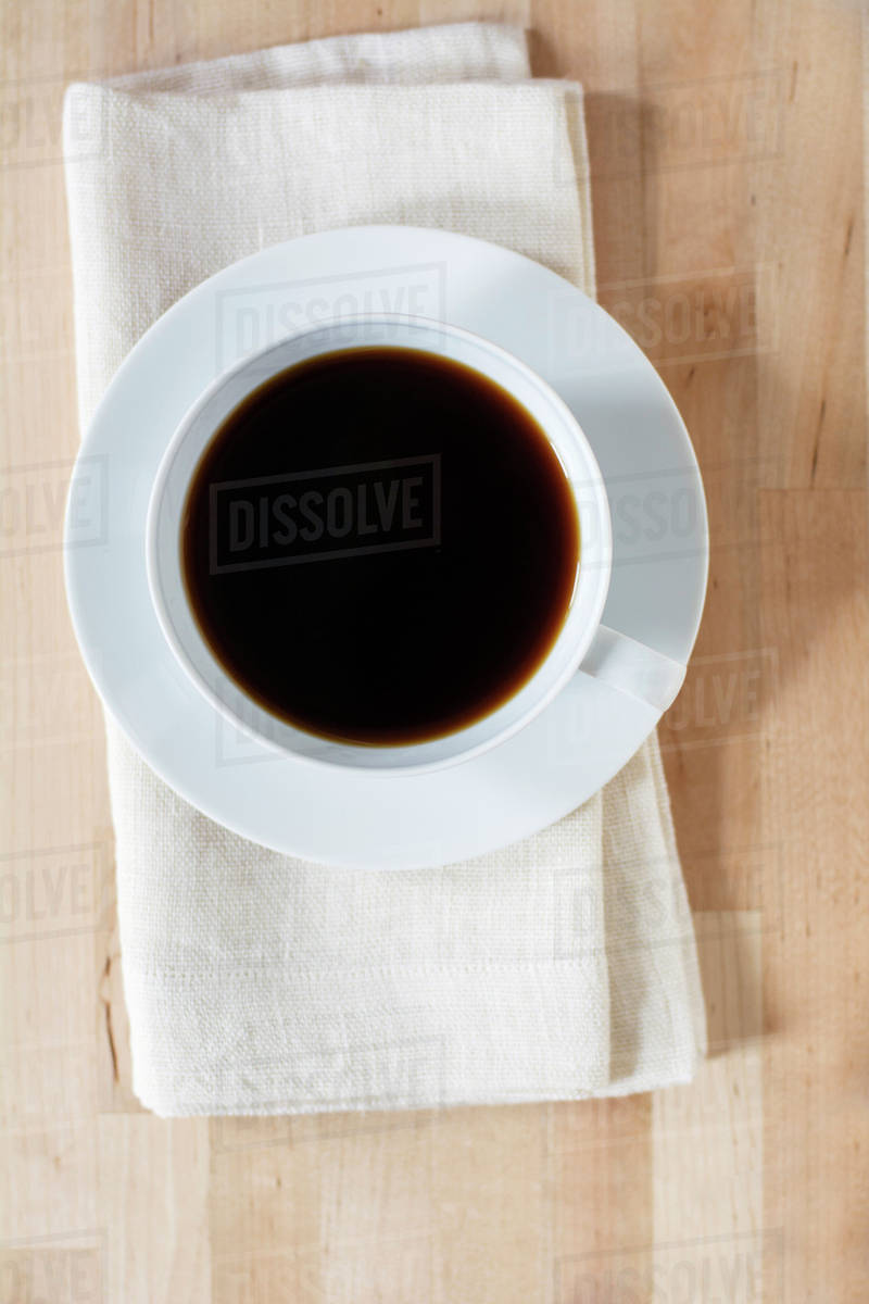 Coffee cup on table - Royalty-free Stock Photo | Dissolve