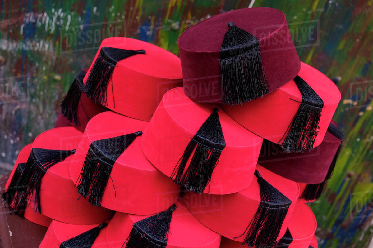 Traditional red Fez hats piled up for sale - Royalty-free Stock Photo ...