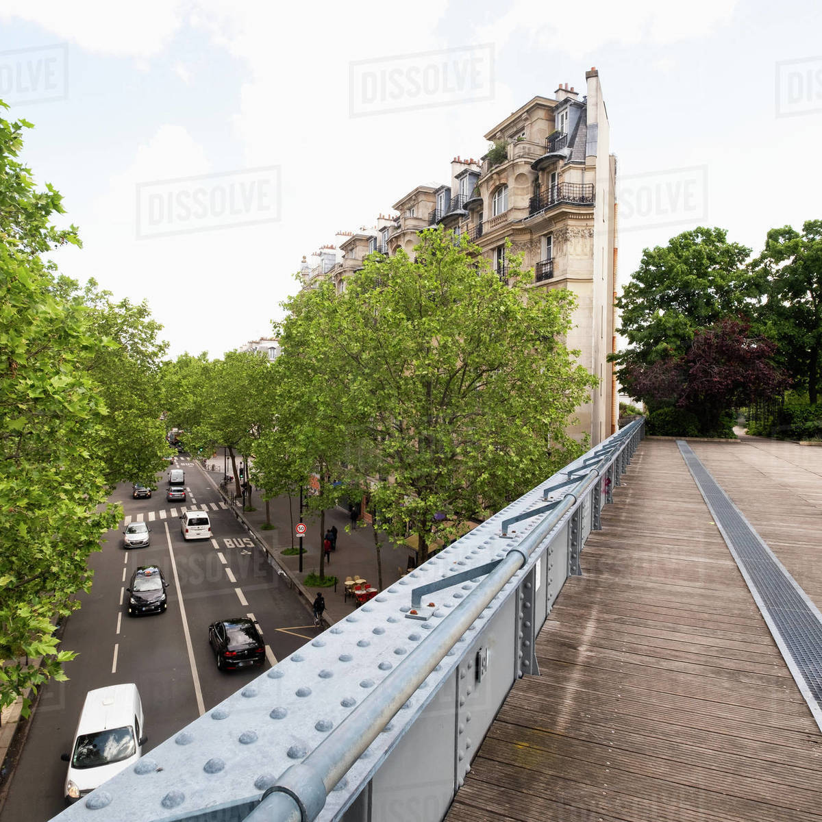 France, Paris, Pedestrian bridge above city street and traffic ...