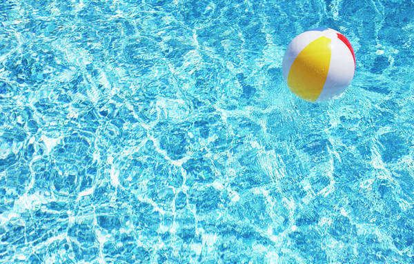 Beach ball in swimming pool - Royalty-free Stock Photo | Dissolve