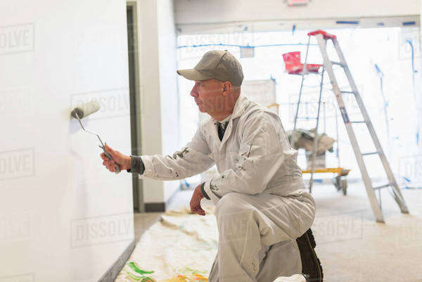 Manual worker painting wall - Royalty-free Stock Photo | Dissolve