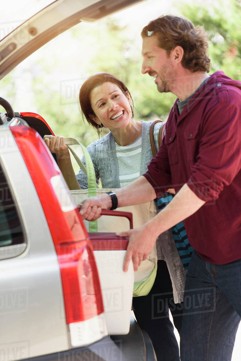 Couple packing their car - Royalty-free Stock Photo | Dissolve