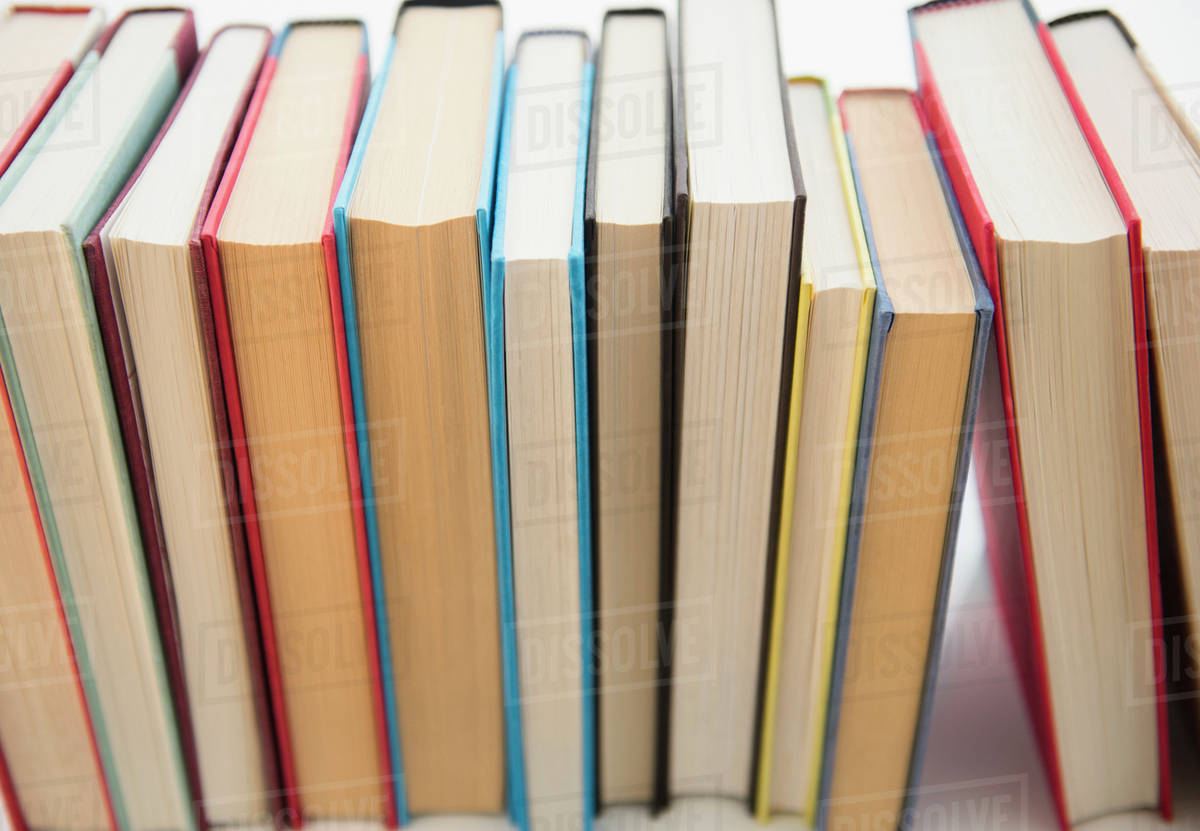 Row of books on white background - Royalty-free Stock Photo | Dissolve