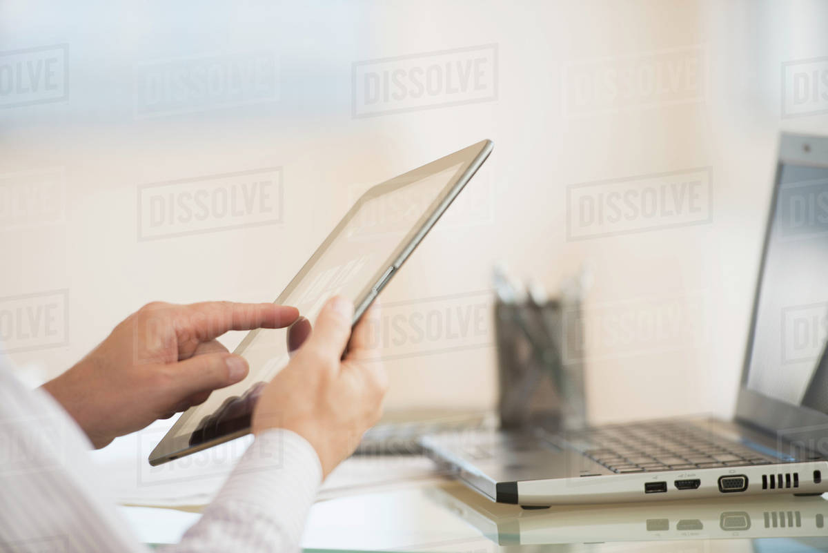 Man using tablet pc - Royalty-free Stock Photo | Dissolve