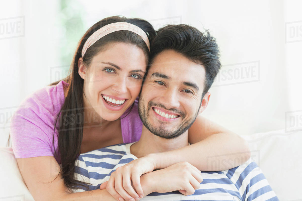 Portrait of young couple smiling - Royalty-free Stock Photo | Dissolve