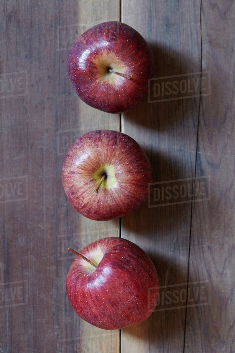 Three apples in row - Royalty-free Stock Photo | Dissolve
