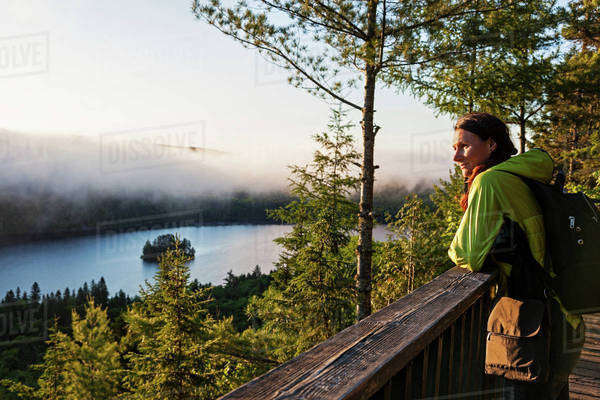 Woman looking at view from observation point - Royalty-free Stock Photo ...