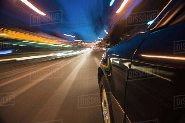 Car speeding through street - Royalty-free Stock Photo | Dissolve