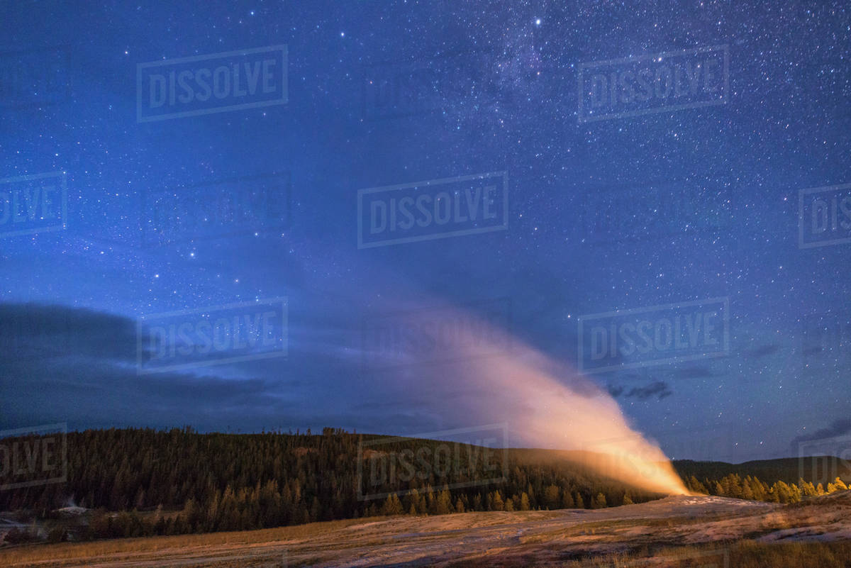 Geyser erupting at night - Royalty-free Stock Photo | Dissolve