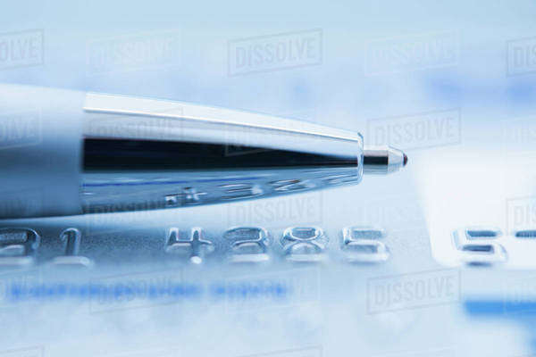 Ballpoint pen on credit card, studio shot - Royalty-free Stock Photo ...