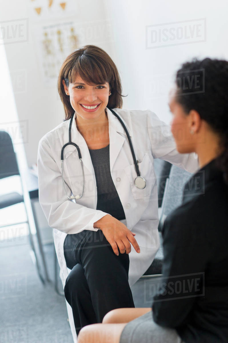 Doctor with patient in office - Royalty-free Stock Photo | Dissolve