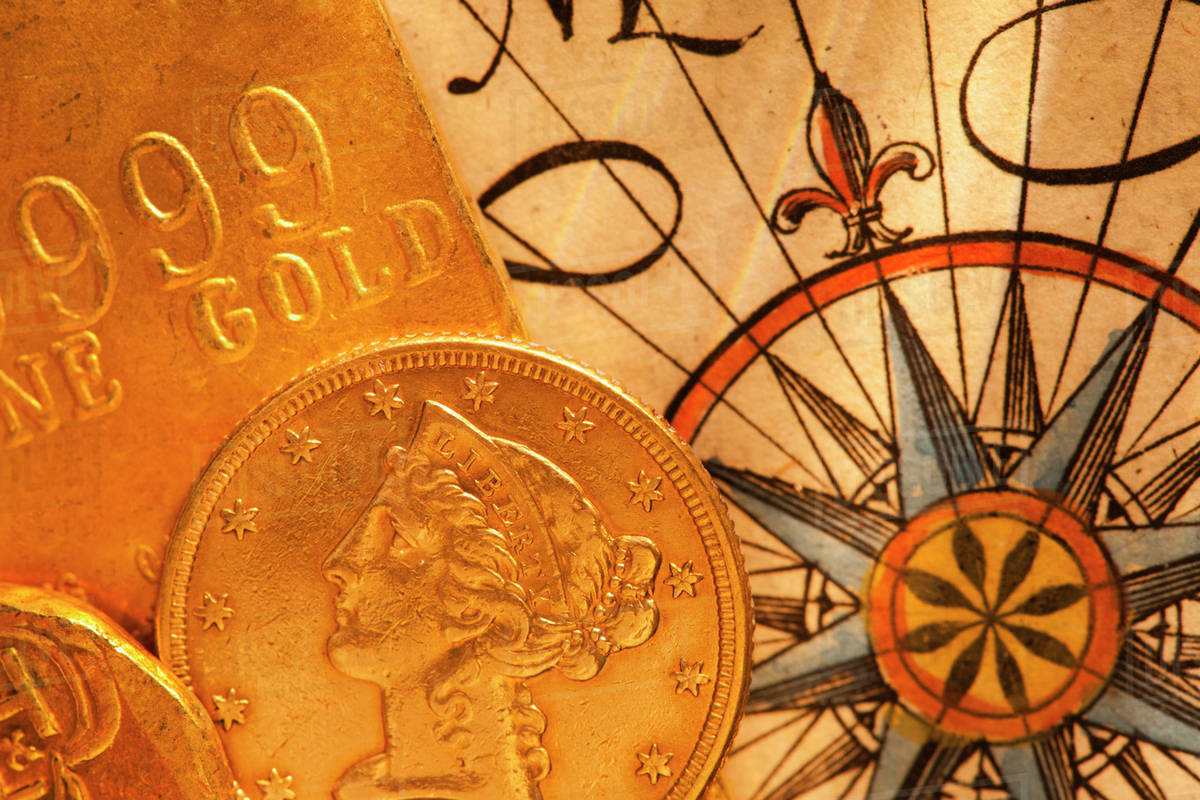 Antique map and coins, studio shot - Royalty-free Stock Photo | Dissolve