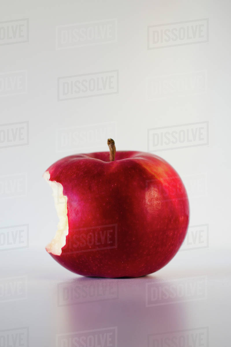 Red apple with missing bite, studio shot - Royalty-free Stock Photo ...