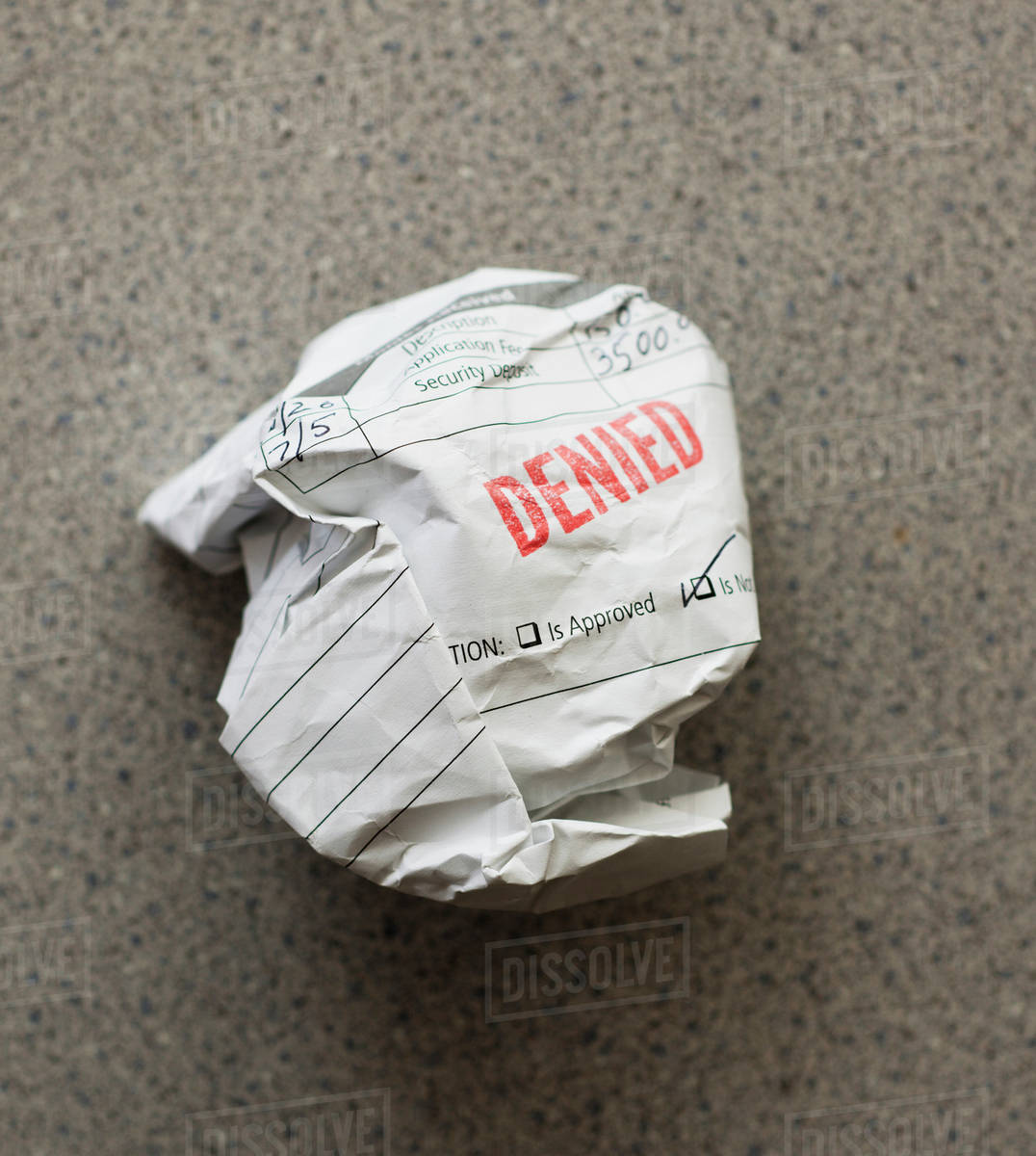 Studio shot of crumpled document - Stock Photo - Dissolve