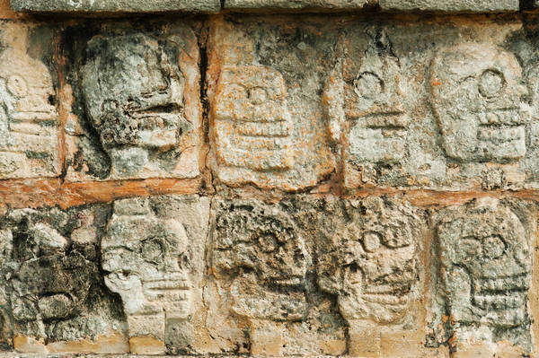 Mayan carvings representing human skulls - Stock Photo - Dissolve
