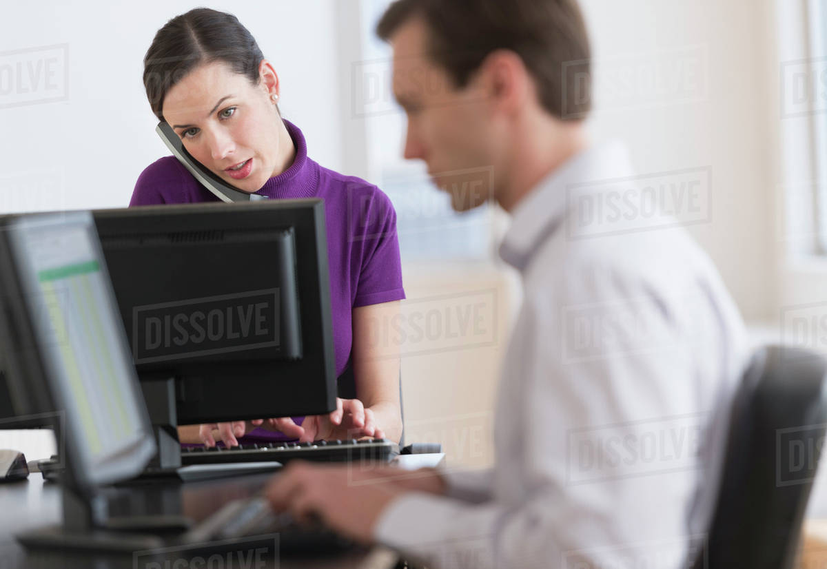 Office workers using computers - Royalty-free Stock Photo | Dissolve