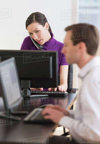 Office workers using computers - Royalty-free Stock Photo | Dissolve