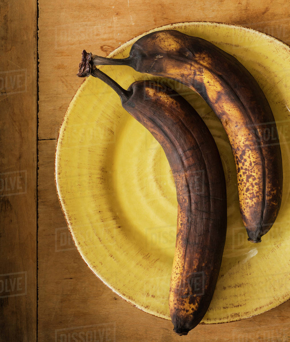 Still life with rotting bananas - Stock Photo - Dissolve