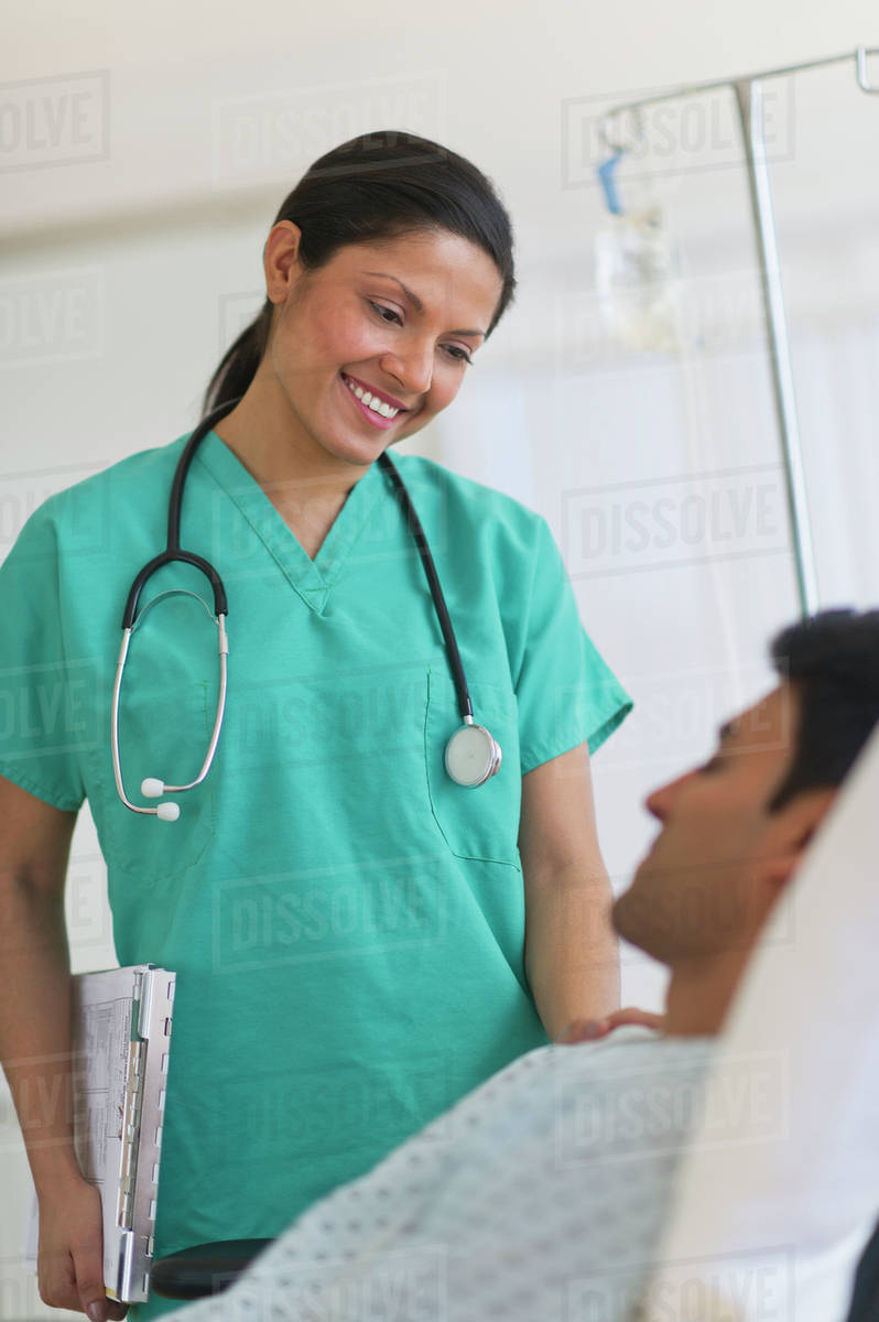 Doctor smiling to patient - Stock Photo - Dissolve