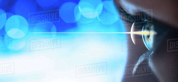 Studio shot of light beam coming from eye - Stock Photo - Dissolve