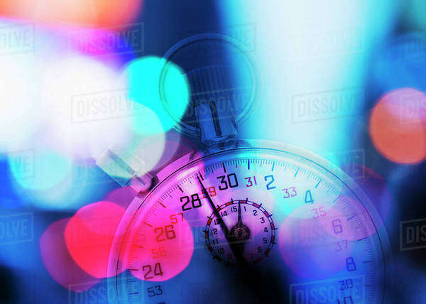 Stopwatch and colorful lights - Stock Photo - Dissolve