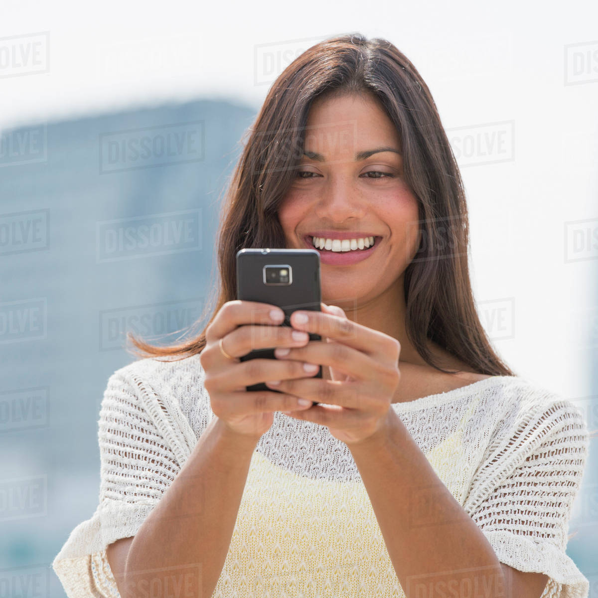 Woman text messaging - Stock Photo - Dissolve