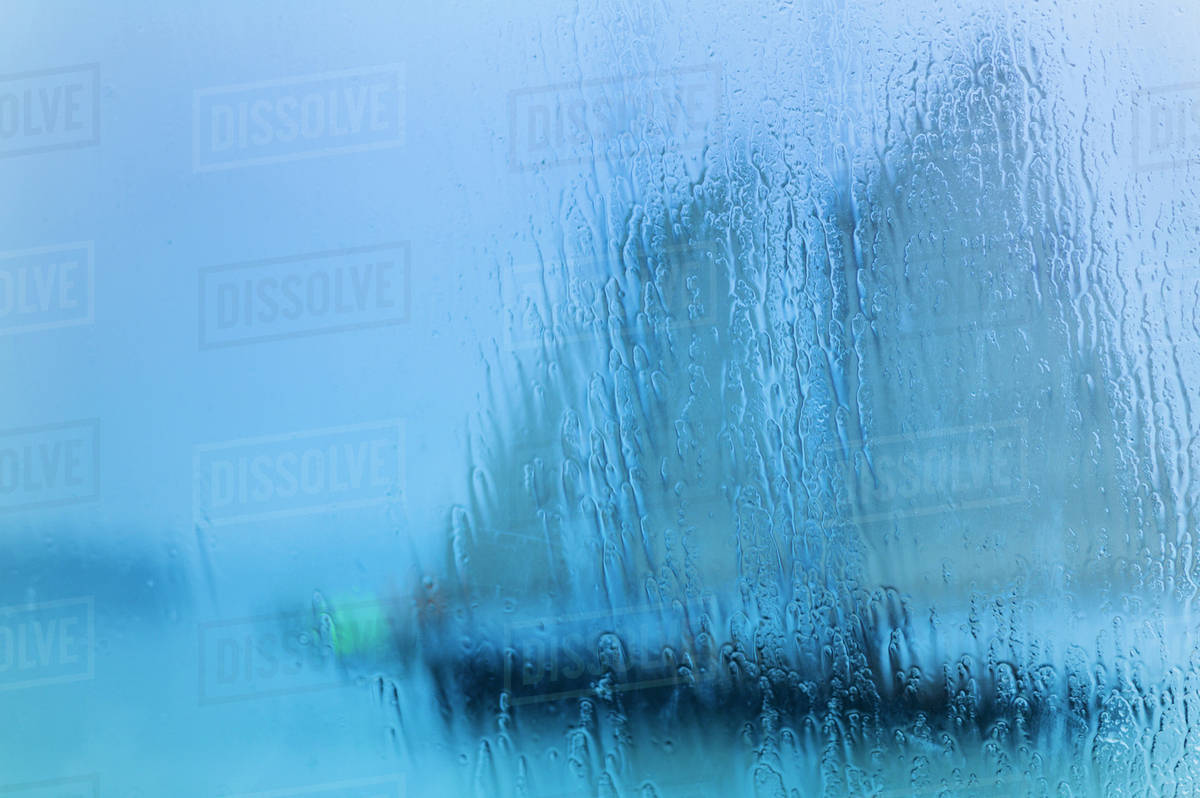Schooner seen through wet window - Stock Photo - Dissolve