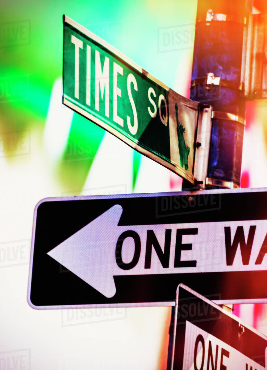 Directional signs at night - Stock Photo - Dissolve