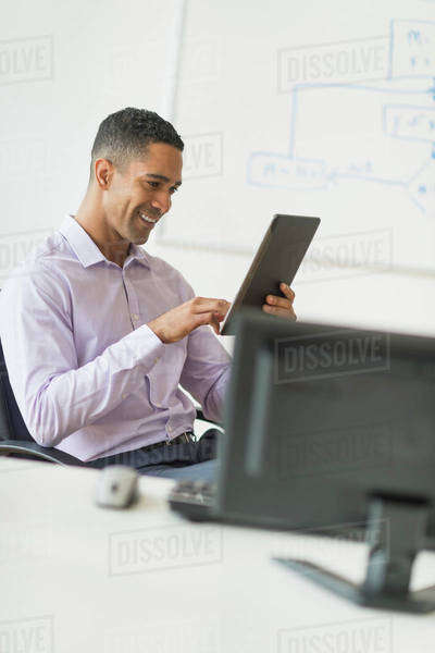 Male business executive working at desk - Royalty-free Stock Photo ...