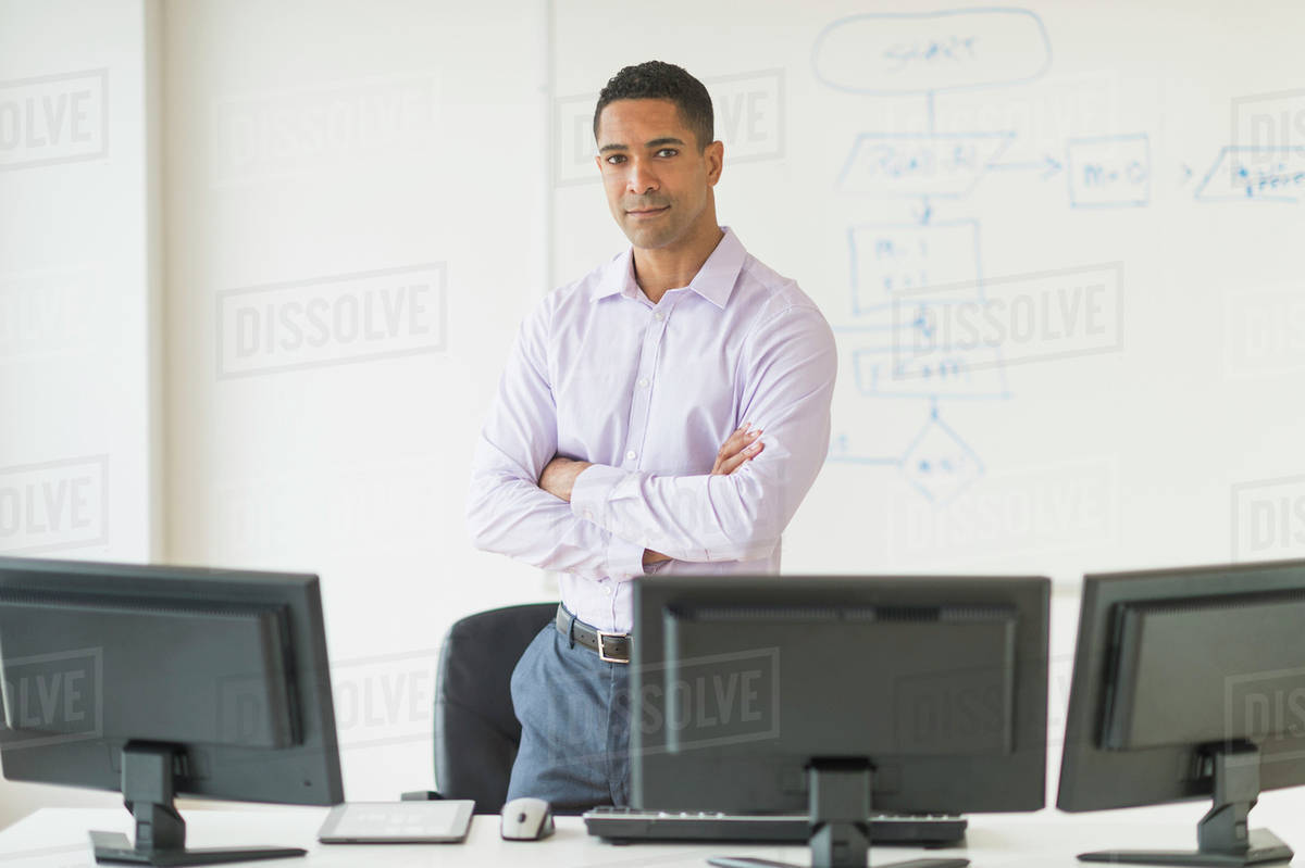 Portrait of male business executive at desk - Royalty-free Stock Photo ...