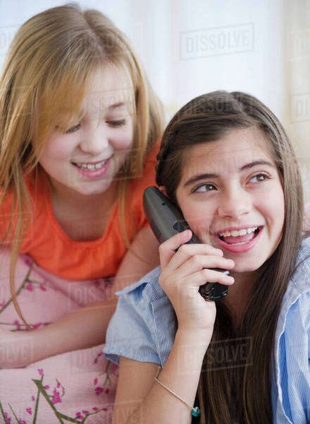 Close up of two girls talking on phone - Royalty-free Stock Photo ...