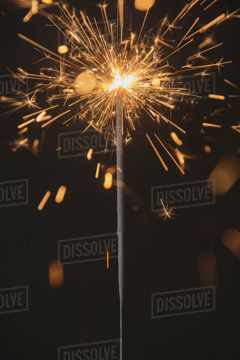 Studio shot of sparkler - Royalty-free Stock Photo | Dissolve