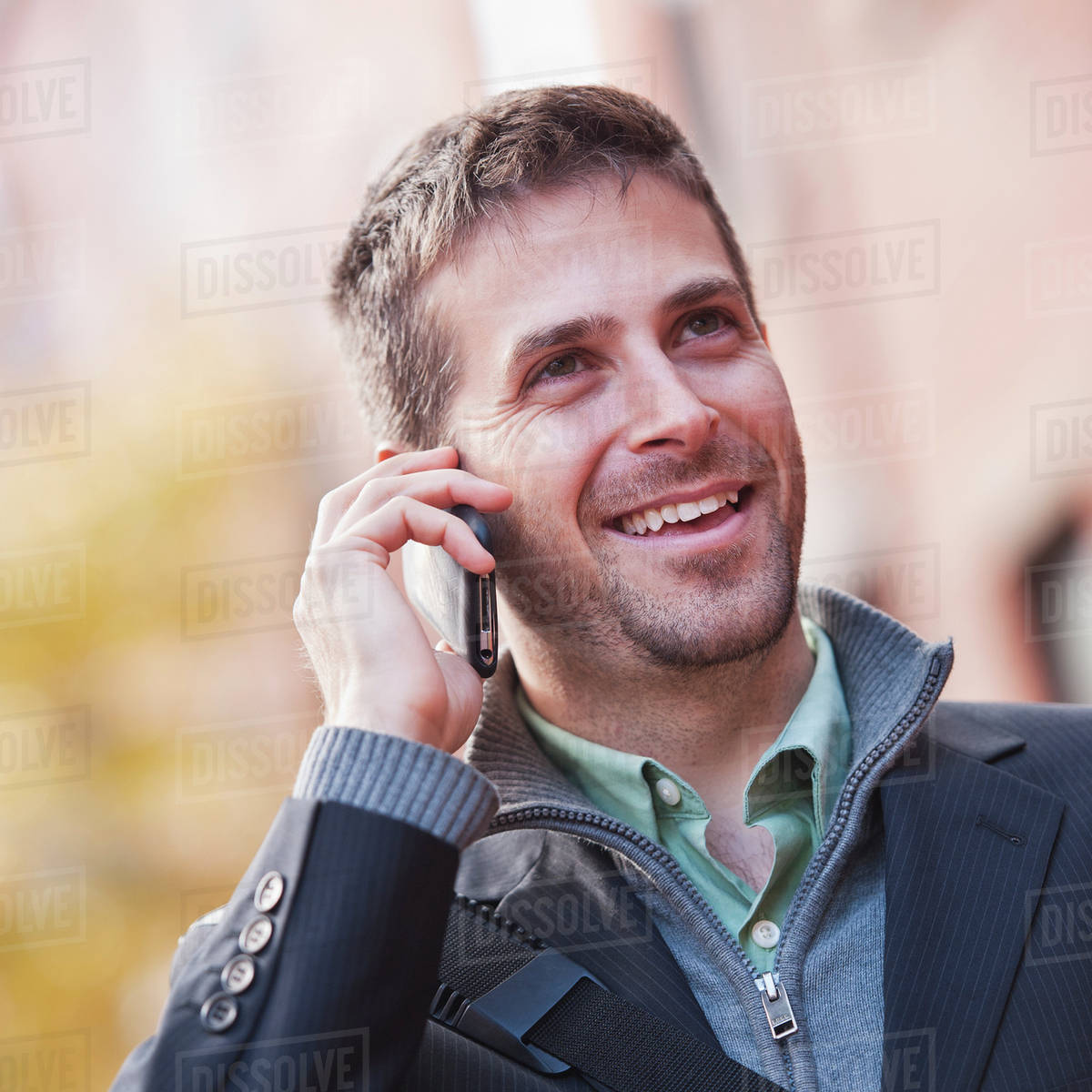 Man talking on mobile phone - Stock Photo - Dissolve