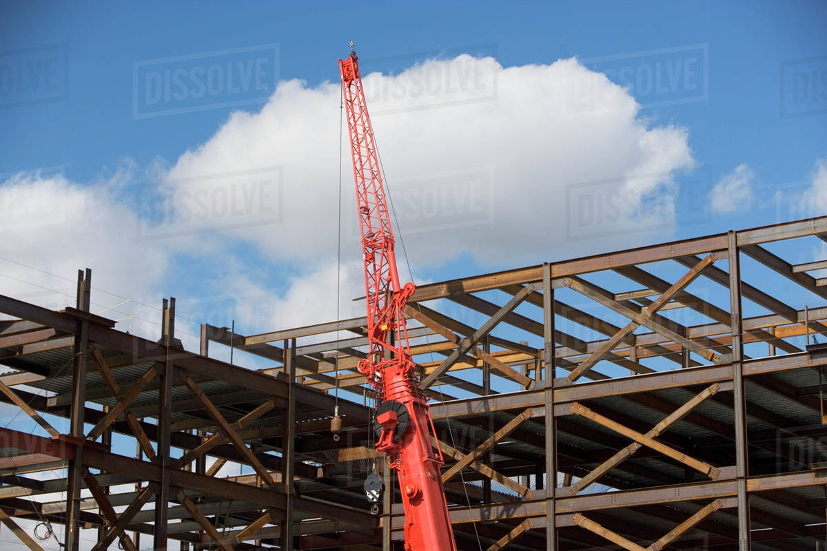 Unfinished structure and crane at construction site - Royalty-free ...