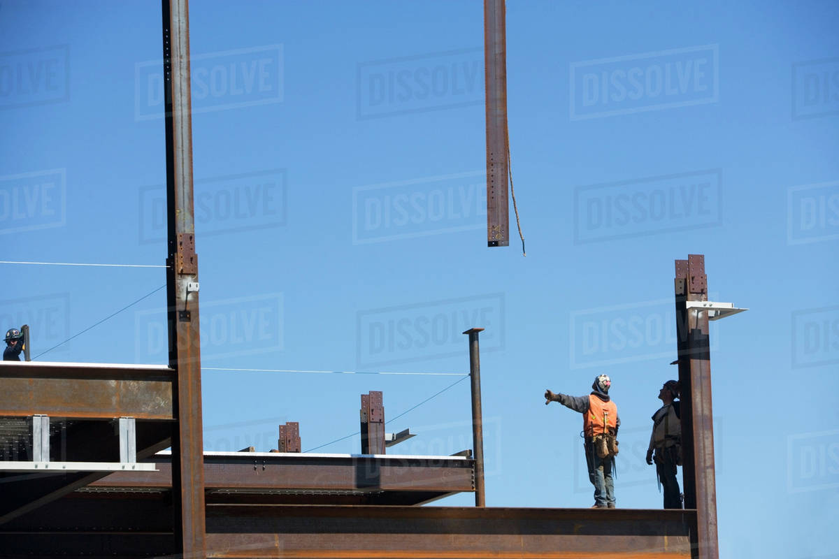 Construction workers on construction frame - Royalty-free Stock Photo ...