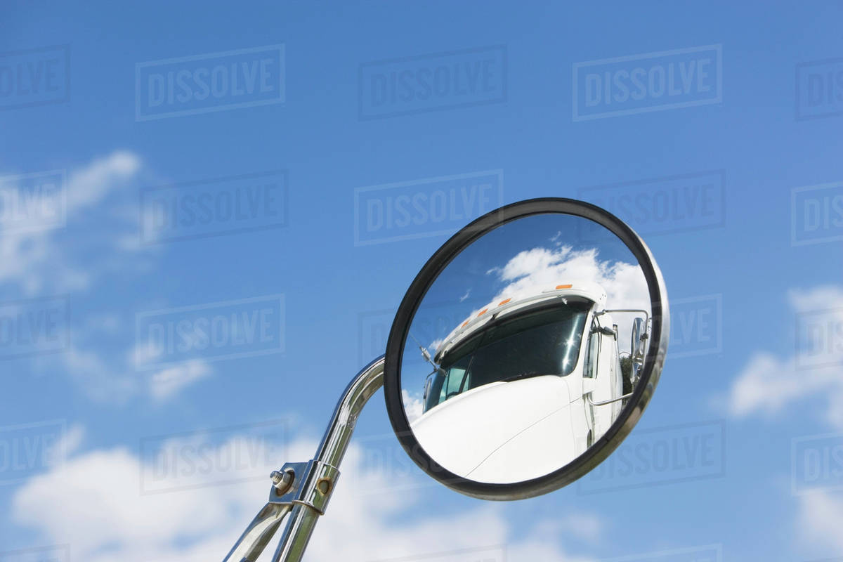 Reflection of semi-truck in side view mirror - Royalty-free Stock Photo ...