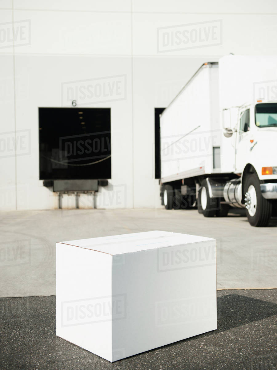 Box outside warehouse - Royalty-free Stock Photo | Dissolve