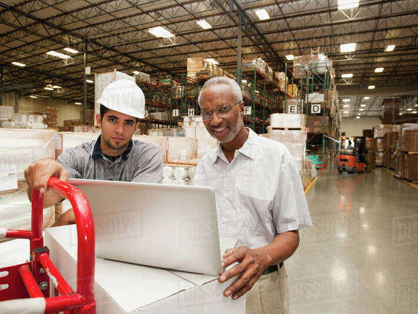 Men working in warehouse - Royalty-free Stock Photo | Dissolve