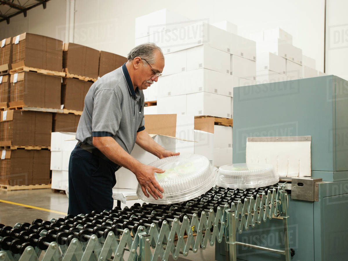 Warehouse worker assembling merchandise - Royalty-free Stock Photo ...