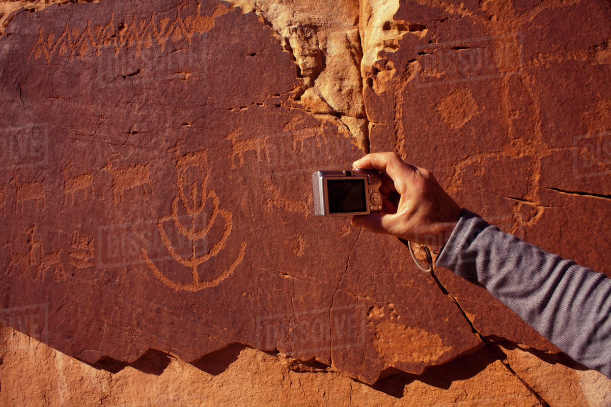 USA, Utah, Native American art on stone wall - Stock Photo - Dissolve