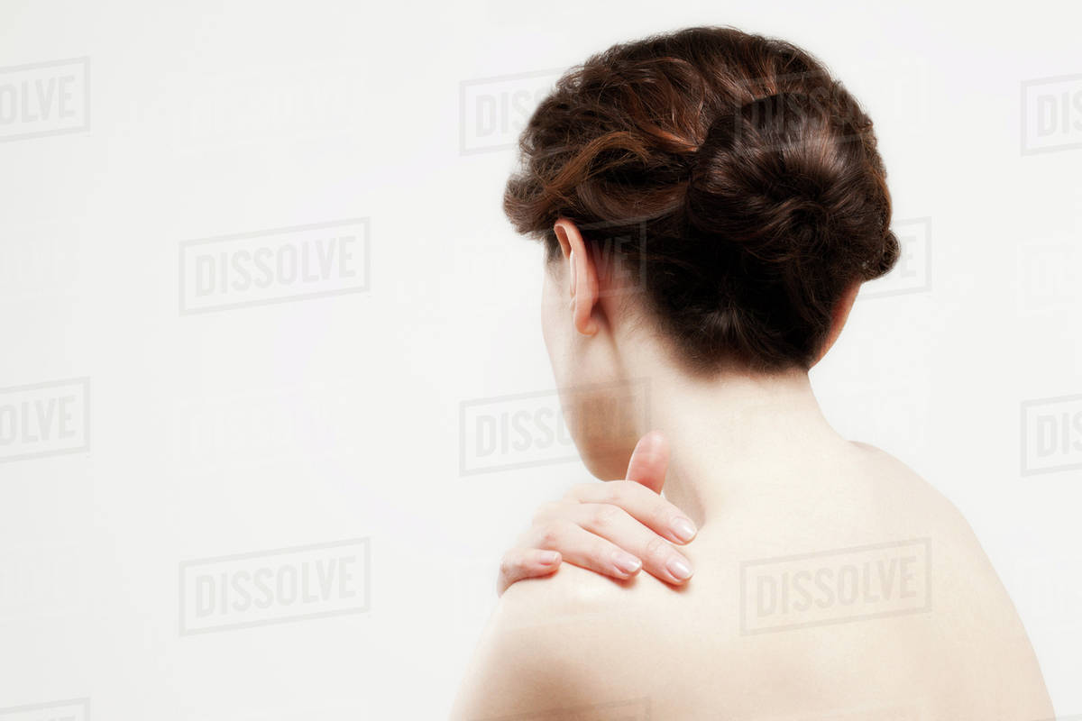 Rear view of beautiful young woman, studio shot - Royalty-free Stock ...