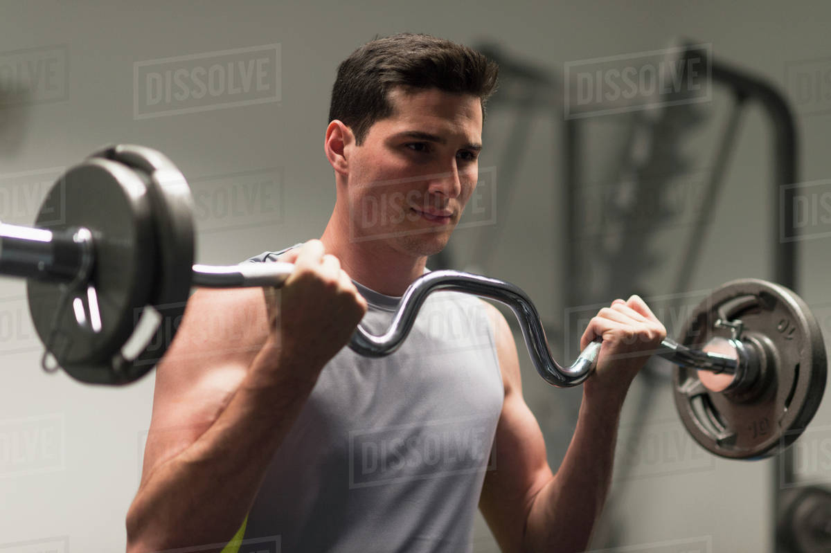 Man lifting weights - Royalty-free Stock Photo | Dissolve