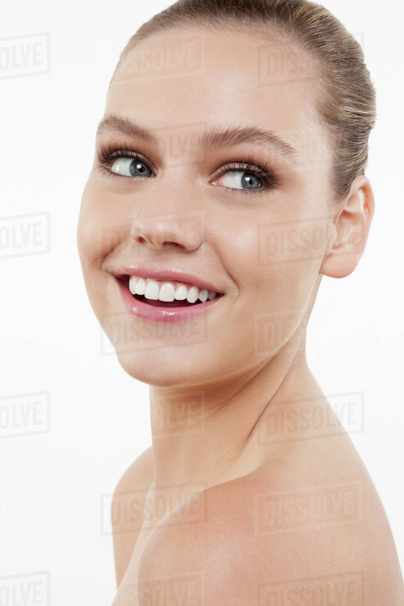 Portrait of cheerful young woman - Stock Photo - Dissolve