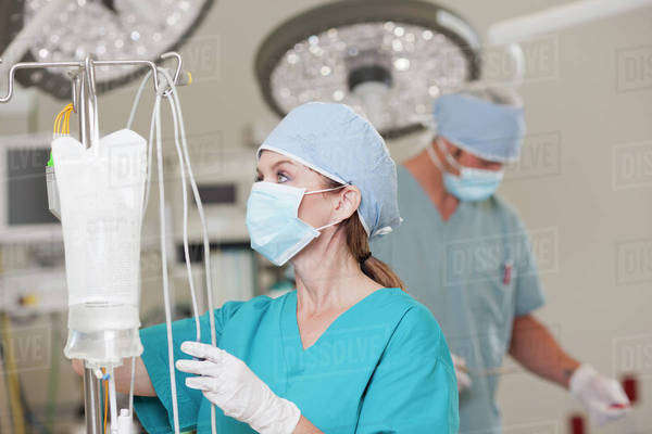 Surgeons getting ready for surgery - Royalty-free Stock Photo | Dissolve