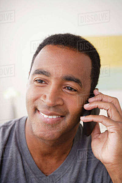 Portrait of smiling mature man talking via mobile - Royalty-free Stock ...