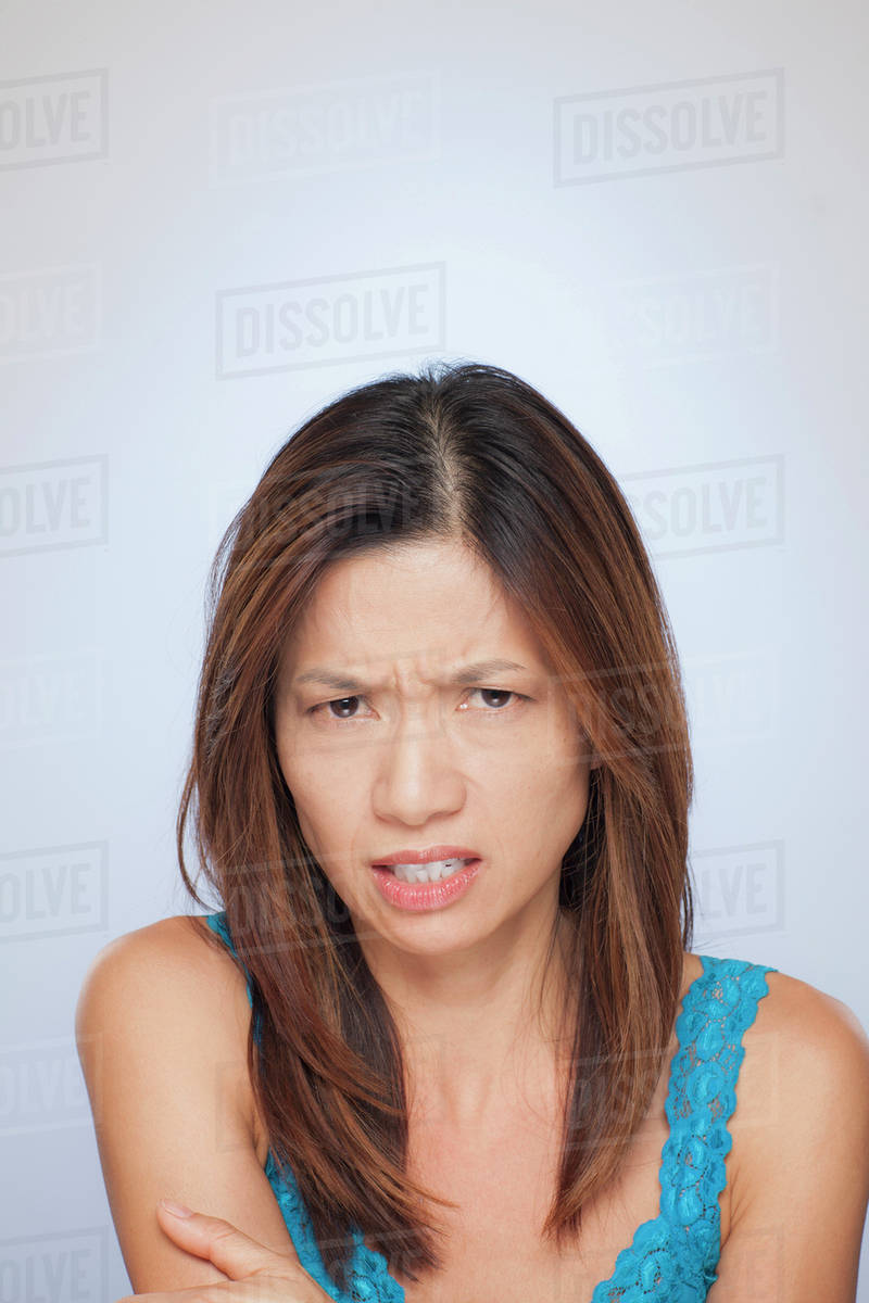 Portrait of woman making face - Royalty-free Stock Photo | Dissolve